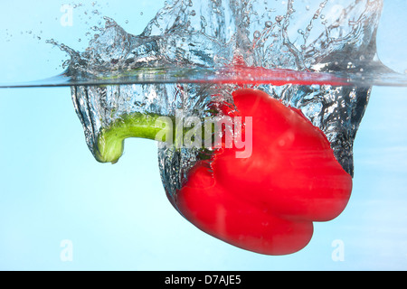 Pepper splashes in water Stock Photo - Alamy