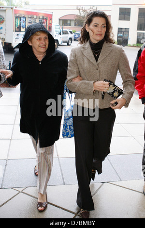 Former Olympic skater Nancy Kerrigan, right, is embraced while arriving ...