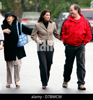 Former Olympic skater Nancy Kerrigan, right, is embraced while arriving ...