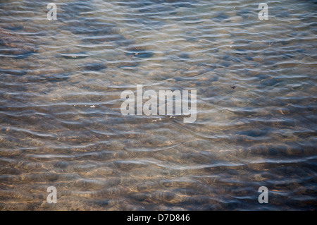 Rocky seabed with water Stock Photo - Alamy