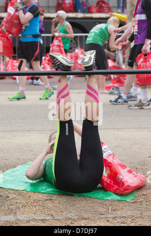 London marathon runners after passing the finish line, wrapped in ...