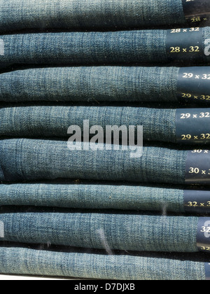 Store Display, Jeans Folded and Stacked on Tables Stock Photo - Alamy