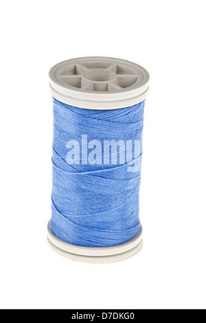 Single spool of blue thread and sewing needle on white background Stock ...
