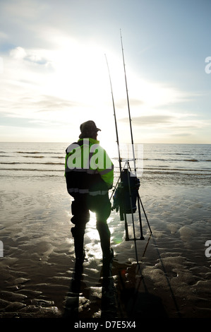 Filey Sands Yorkshire UK. Fishing Coble and fishermen on the Sands ...