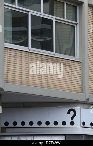 Question mark on the facade of a building Stock Photo - Alamy