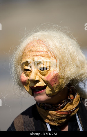 Participants wearing strange weird masks at village carnival in the ...