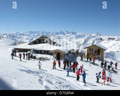 Looking south from the top of Cime Caron, Val Thorens with piste signs ...