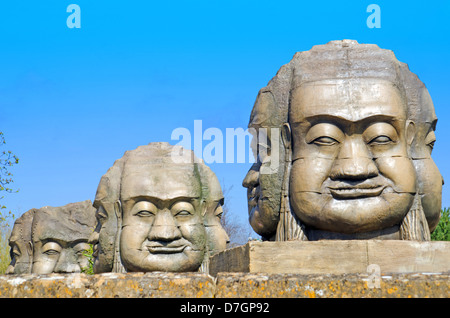 Carved stone idol head statue Stock Photo - Alamy