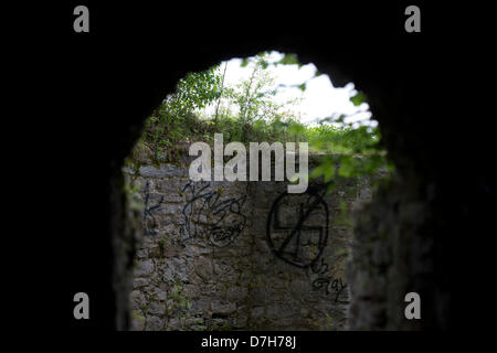 crossed out swastika on a wall, anti nazi symbol against fascism and ...