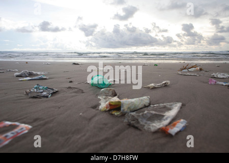 Plastic pollution on shore of beach. Ocean microplastic marine debris ...