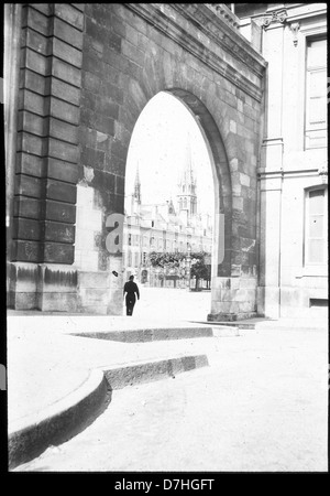 This post-WWII photograph captures a French street scene, depicting the ...