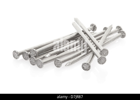 Sharp shiny metal nails on white background Stock Photo - Alamy