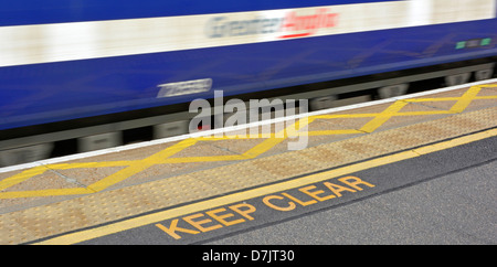 train station platform warning signs danger Stock Photo - Alamy