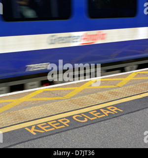 train station platform warning signs danger Stock Photo - Alamy