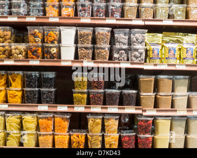 Display of packaged snacks in convenience store window Stock Photo - Alamy