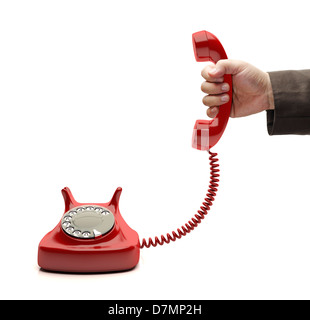 Hand holding a telephone receiver Stock Photo - Alamy