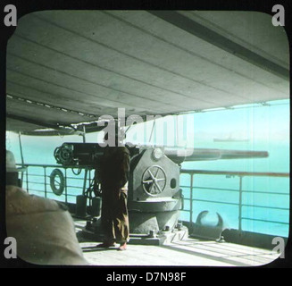 A photograph of naval guns mounted on a U.S. Navy ship, identified as ...