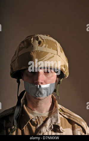 Soldier with his mouth taped over. Soldier is wearing British Military ...