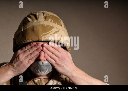 Soldier with his mouth taped over. Soldier is wearing British Military ...