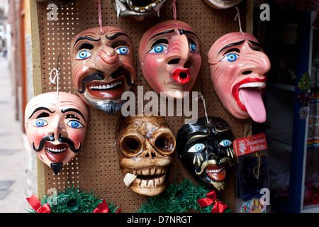 Traditional Peruvian masks hanging at a market in Cusco City, Peru ...