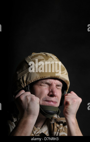 British soldier suffering from shell shock/PTSD, against a black ...