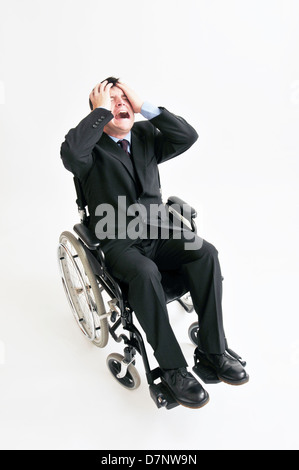 disabled man scream by despair sitting on wheelchair isolated on black ...