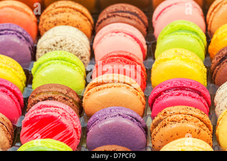 French colorful macarons in a rows Stock Photo - Alamy