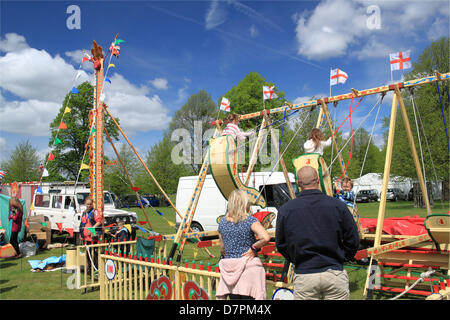 Old fashioned fairground rides at East Prawle fair, Devon Stock Photo ...