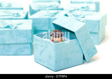 Cyan gift boxes with ring closeup on white background Stock Photo - Alamy