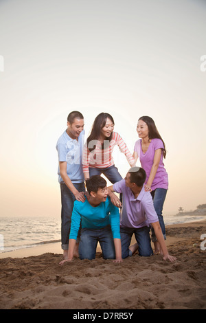 Human pyramid on the beach Stock Photo - Alamy