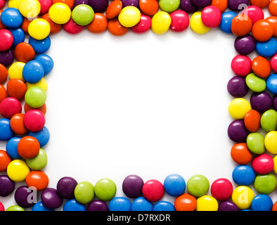 Frame made of colorful candies on white background Stock Photo - Alamy