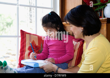 young student working at home with parent Stock Photo - Alamy