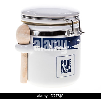 White pot of ceramic and wooden spoon on gray background Stock Photo ...