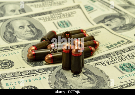 Ammunition from the gun on money bills. Bullets on Euros money ...