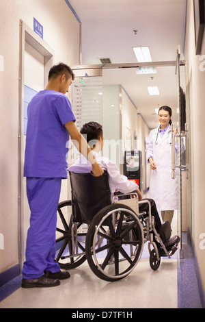 Hospital staff helping patient in emergency Stock Photo - Alamy