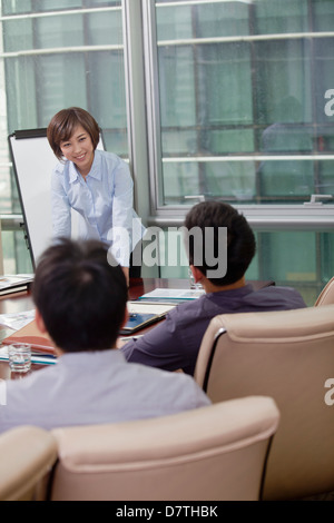 Chinese businesswoman giving presentation in office Stock Photo - Alamy