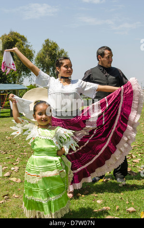 Women in typical costumes dancing in the procession. Hundreds of people ...