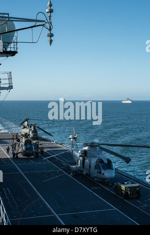 Merlin HM2, RAF Chinook and Royal Navy Sea King on the flight deck of ...