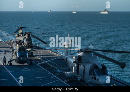 Merlin HM2, RAF Chinook and Royal Navy Sea King on the flight deck of ...