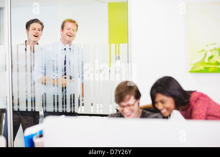 Office worker eavesdropping Stock Photo - Alamy