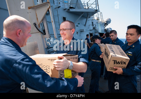 US Navy A working party moves the cargo from the hangar bay to the ...