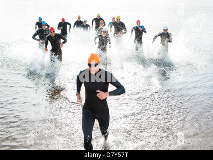 Woman emerging from water Stock Photo - Alamy