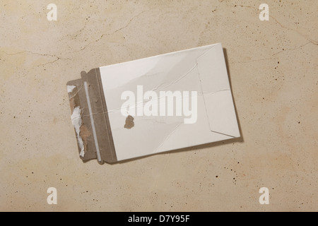 An air mail envelope slightly worn and torn Stock Photo - Alamy