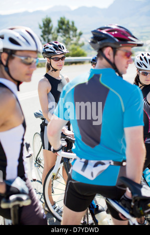 Cyclists talking before race Stock Photo - Alamy