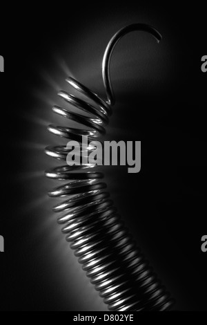 Close-up of coiled metal spring. In B/W Stock Photo - Alamy