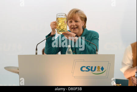 German Chancellor Angela Merkel toasts a mug of beer at the Truderinger ...