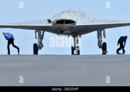 Flight deck crew prepare the X-47B for launch aboard CVN 77 Stock Photo ...