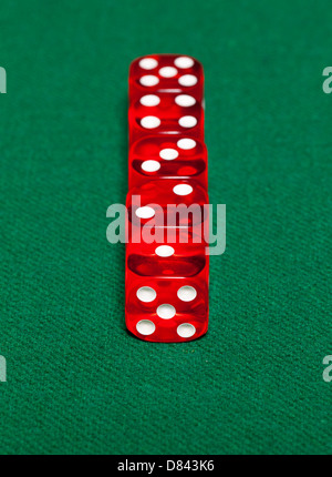 red dice on green baize Stock Photo - Alamy
