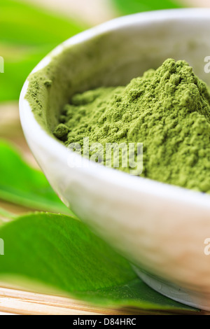 Matcha tea powder with green leaf. Asian beverage concept Stock Photo ...