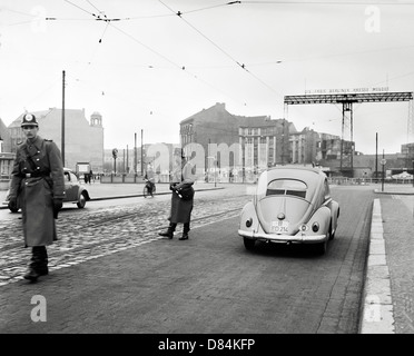 March 1959, Volkspolizei East German police officer controlling cars at ...